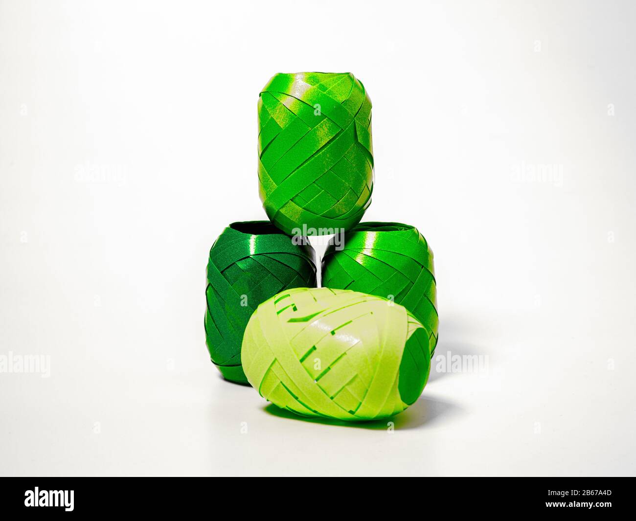 four rolls of ribbon for decorating gifts in different green colours in ...