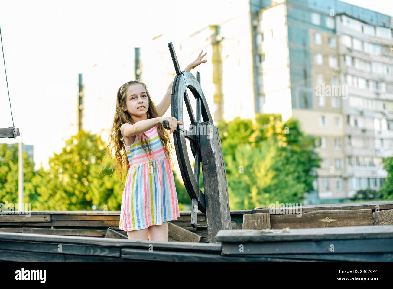 Portrait of a cute little girl nine years old. Girl 9 years old in the summer Stock Photo - Alamy
