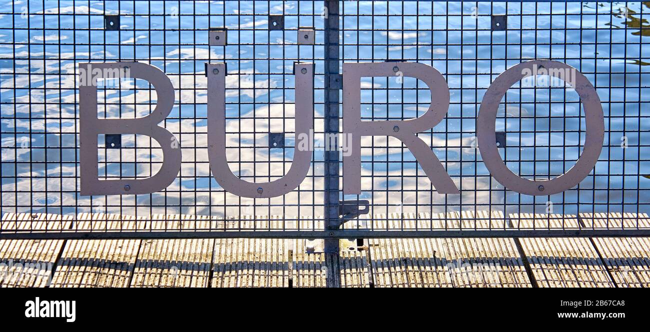 Office sign outside by the water. Office as text in German Stock Photo ...