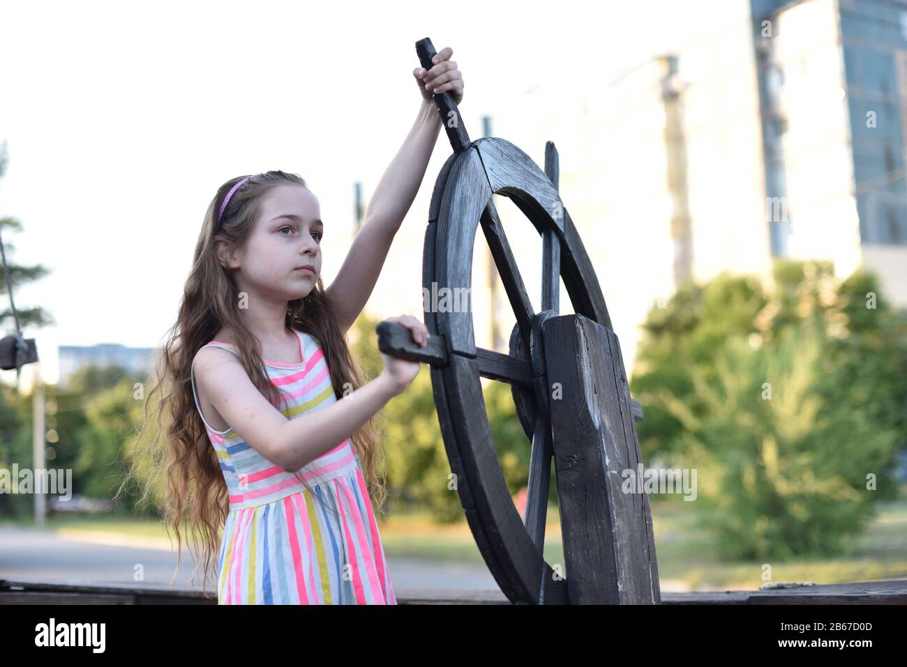 Portrait of a cute little girl nine years old. Girl 9 years old in the summer Stock Photo - Alamy