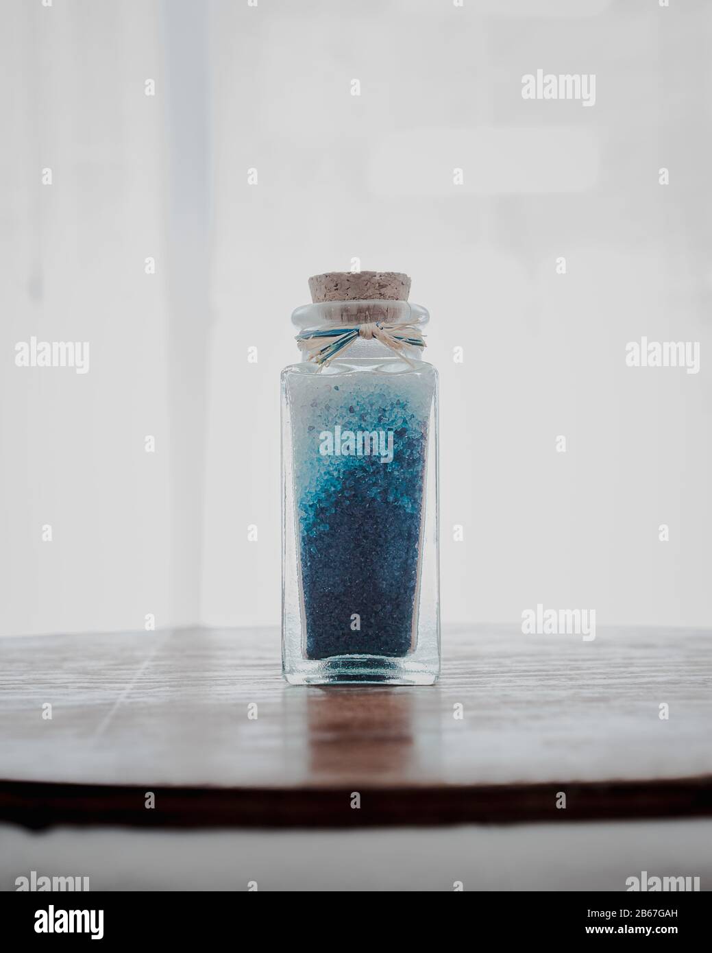fancy bottle with blue bath salts for relaxing spa treatments with ...