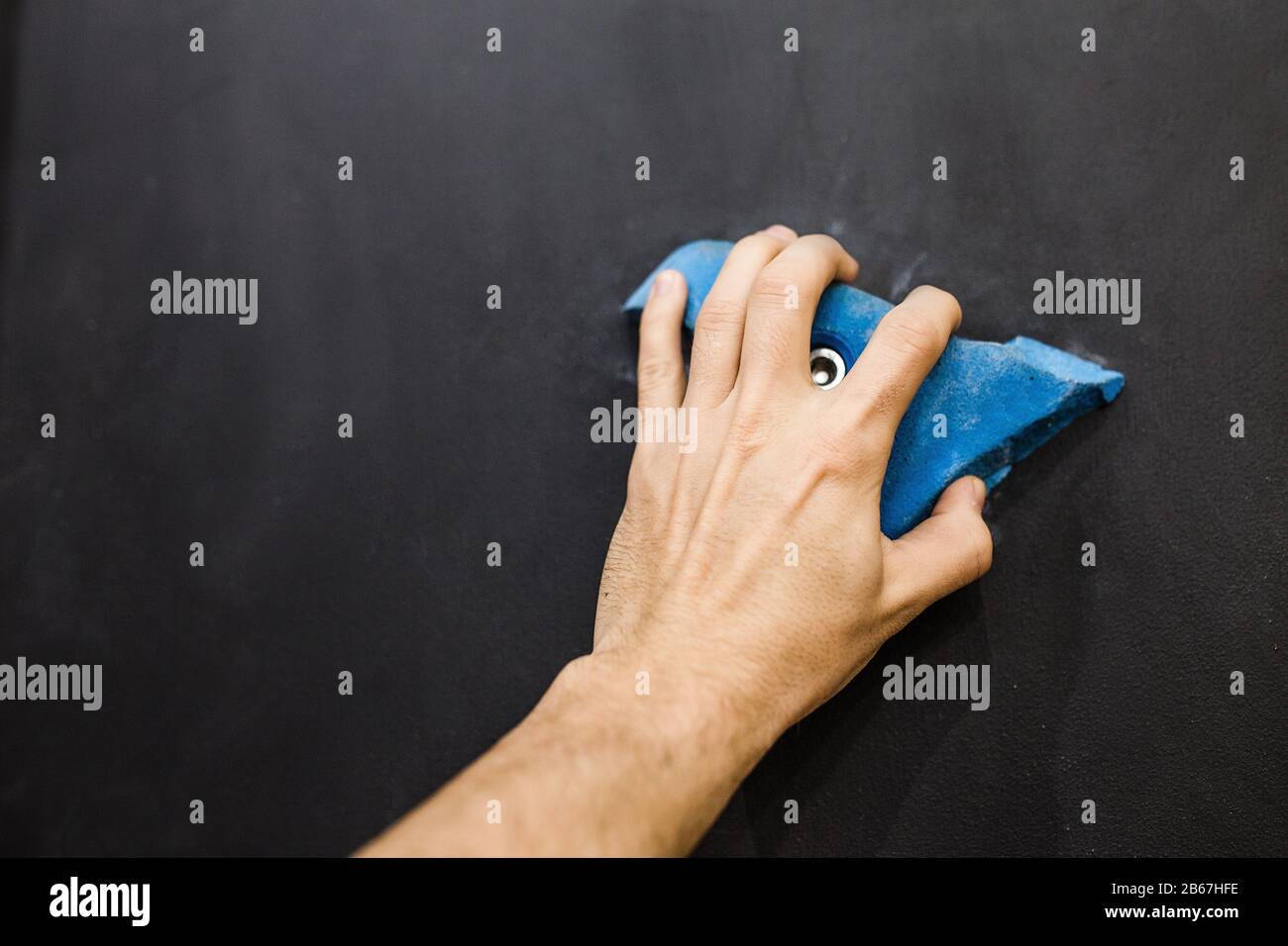 Man clinging to cliff hi-res stock photography and images - Alamy