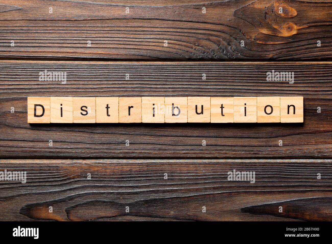distribution word written on wood block. distribution text on table ...