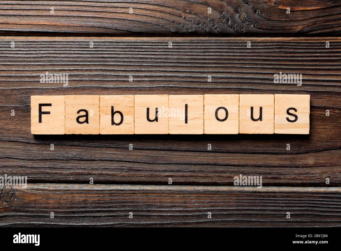 Fabulous word written on wood block. Fabulous text on wooden table for ...
