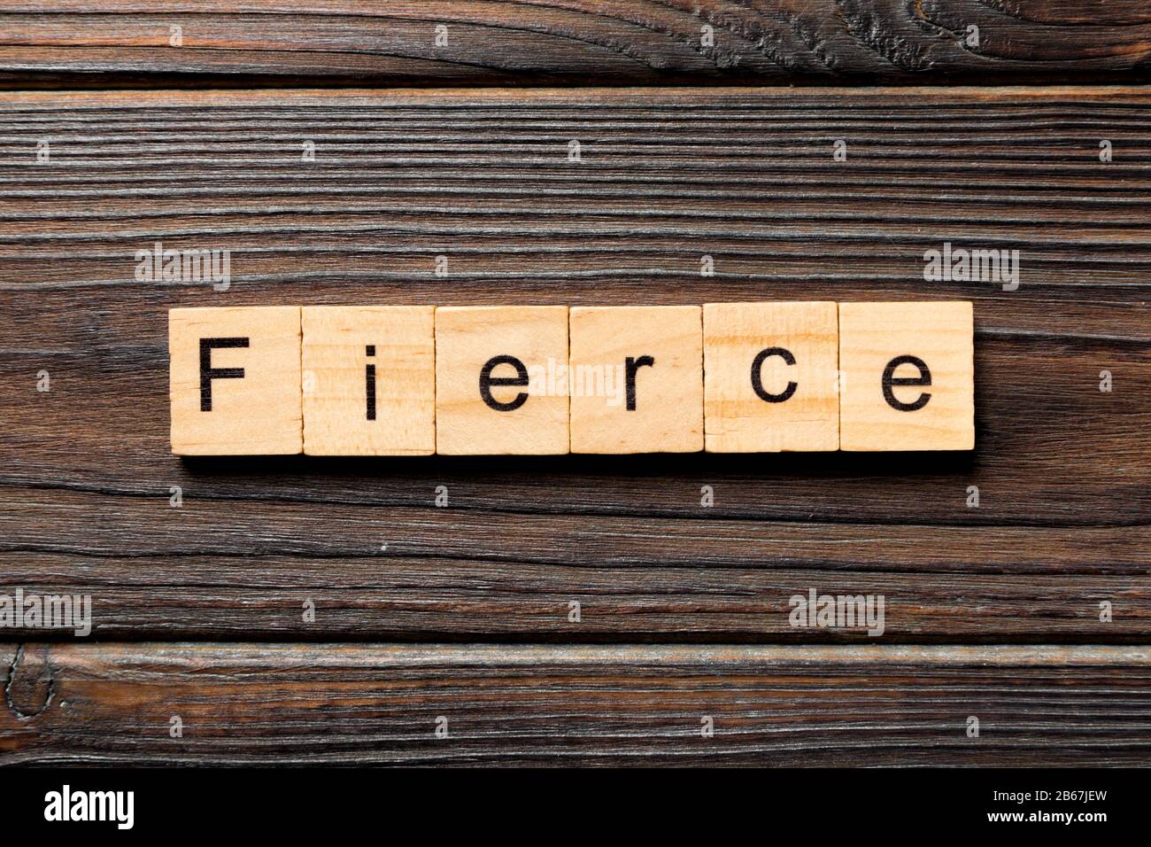 Fierce word written on wood block. Fierce text on wooden table for your ...
