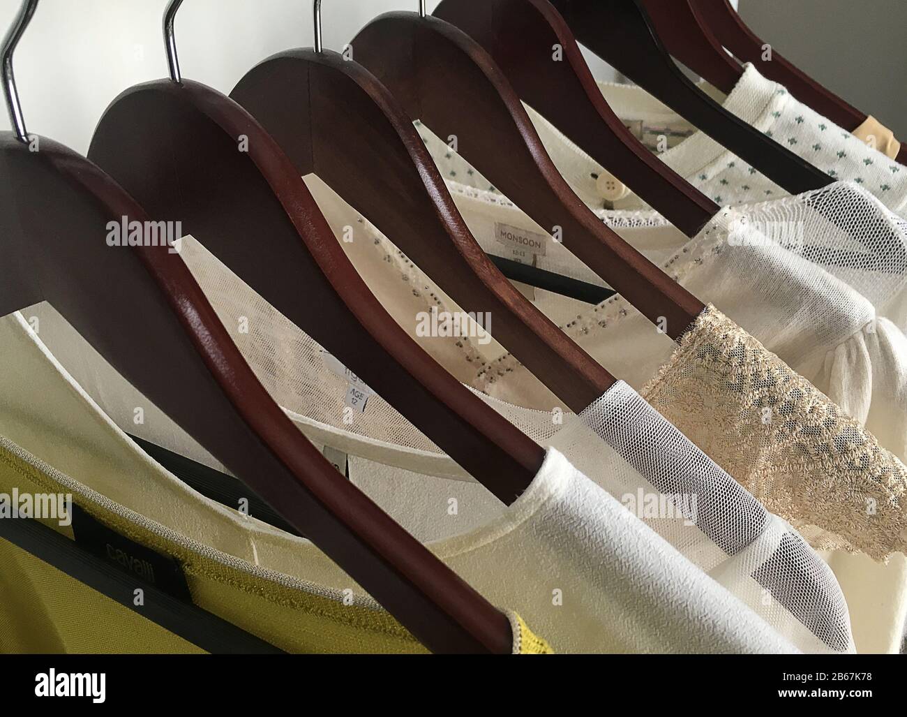 Fashion cloth of women on rack Stock Photo - Alamy