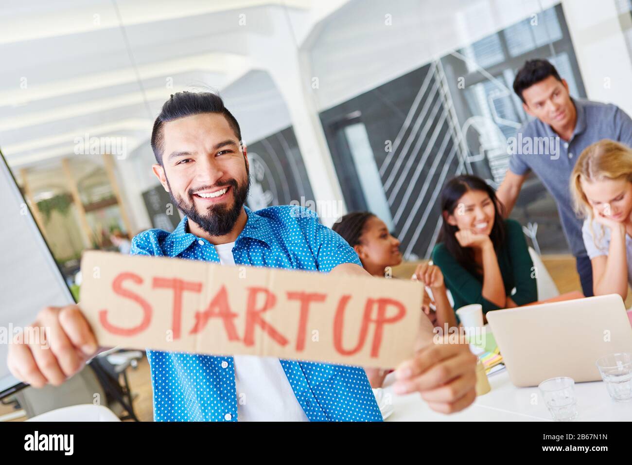 Successful start-up business team works together in the office Stock ...