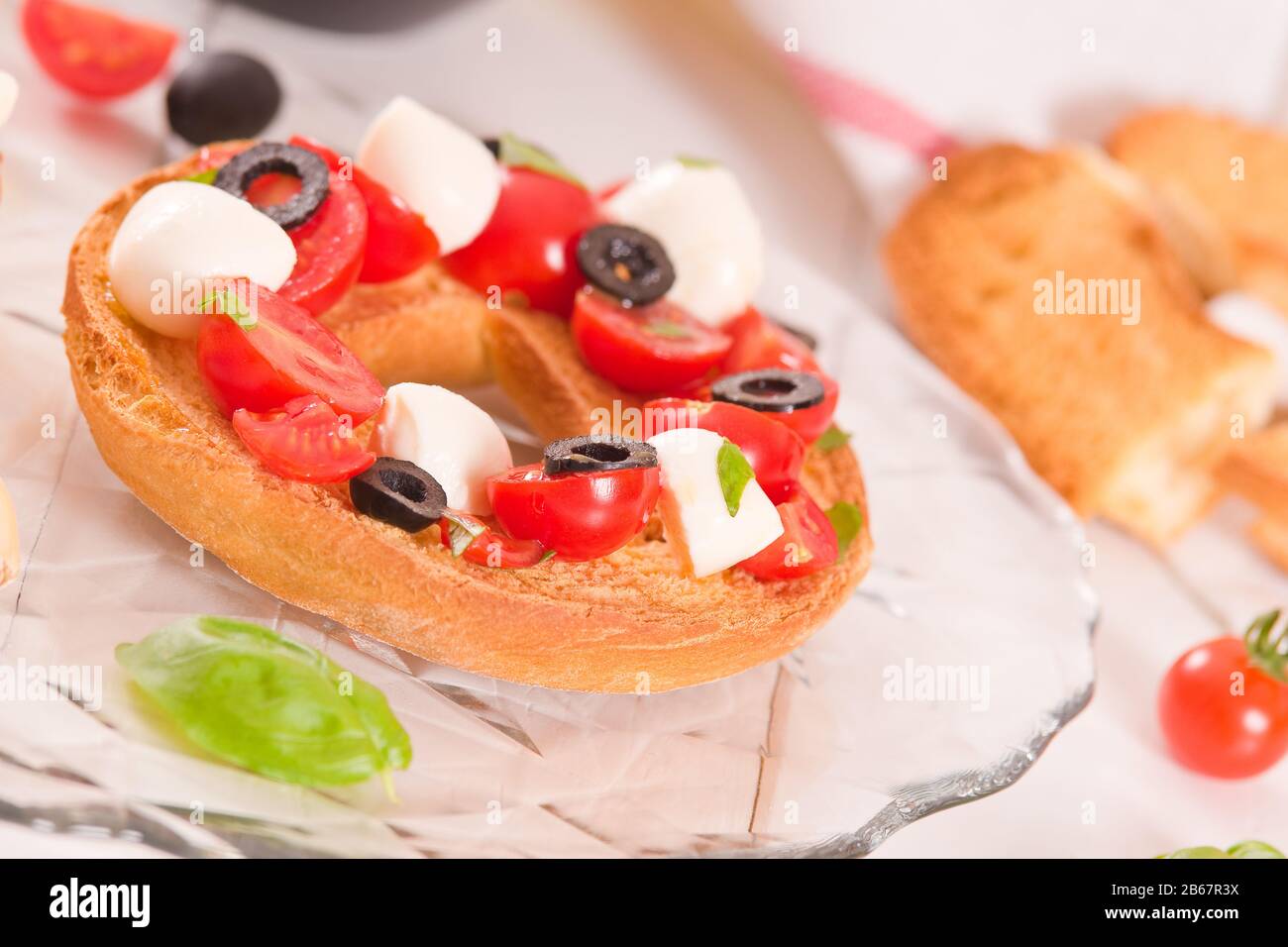 Friselle with tomatoes and mozzarella cheese Stock Photo - Alamy