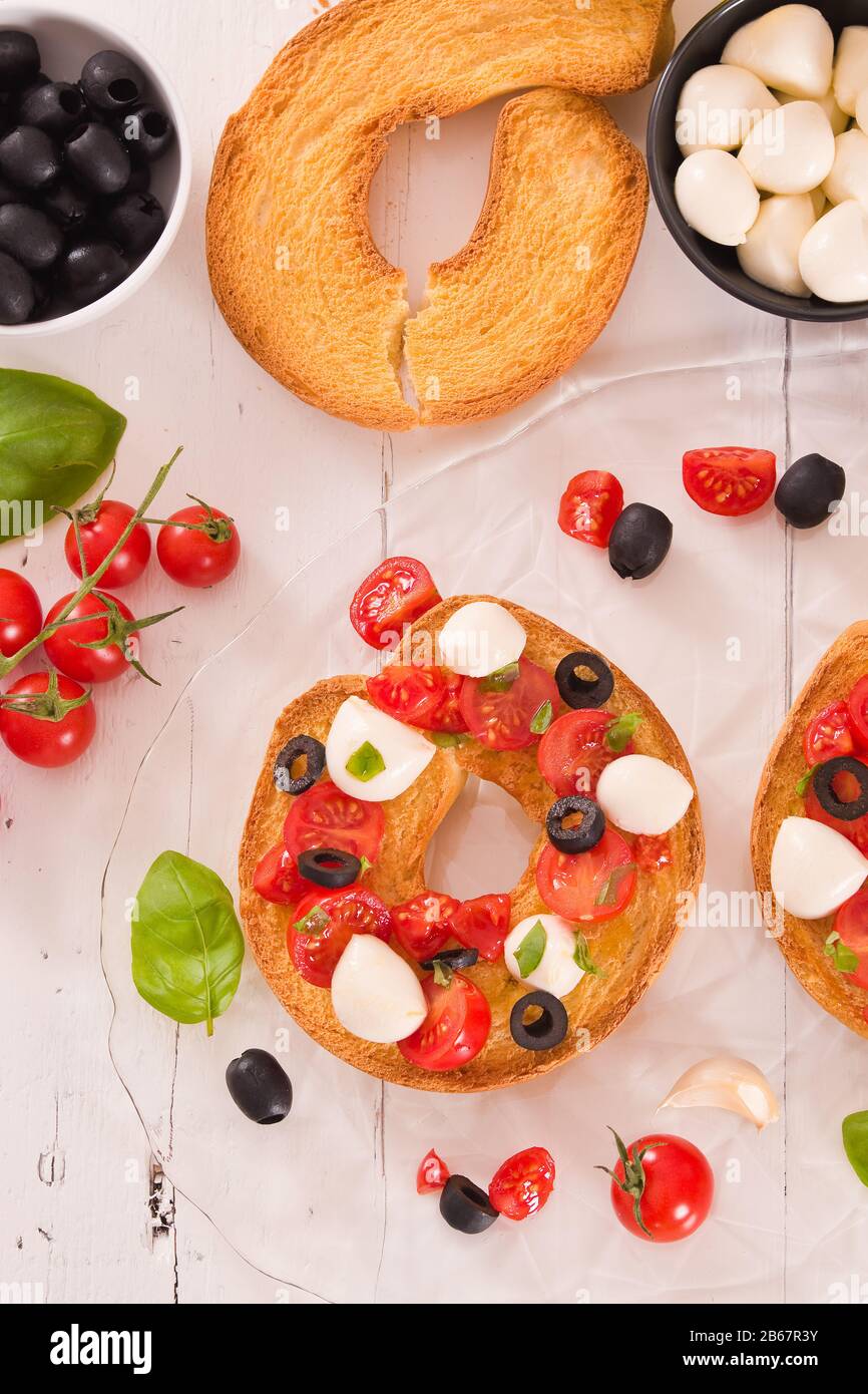 Friselle with tomatoes and mozzarella cheese Stock Photo - Alamy