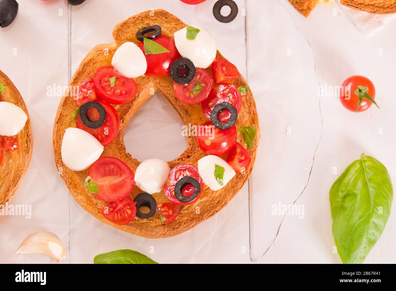 Friselle with tomatoes and mozzarella cheese Stock Photo - Alamy