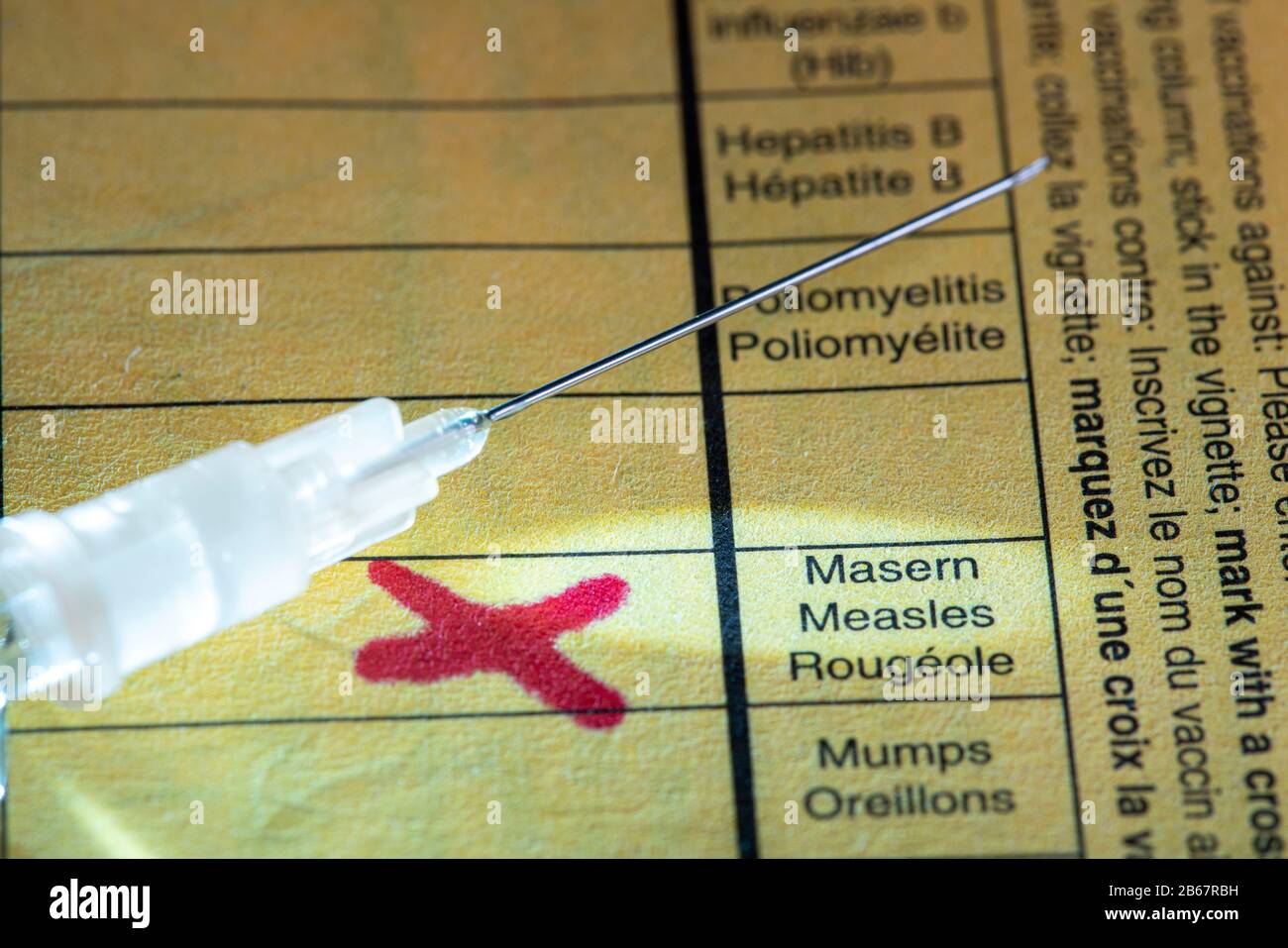 Measles vaccination, vaccination card, syringe with measles vaccine ...