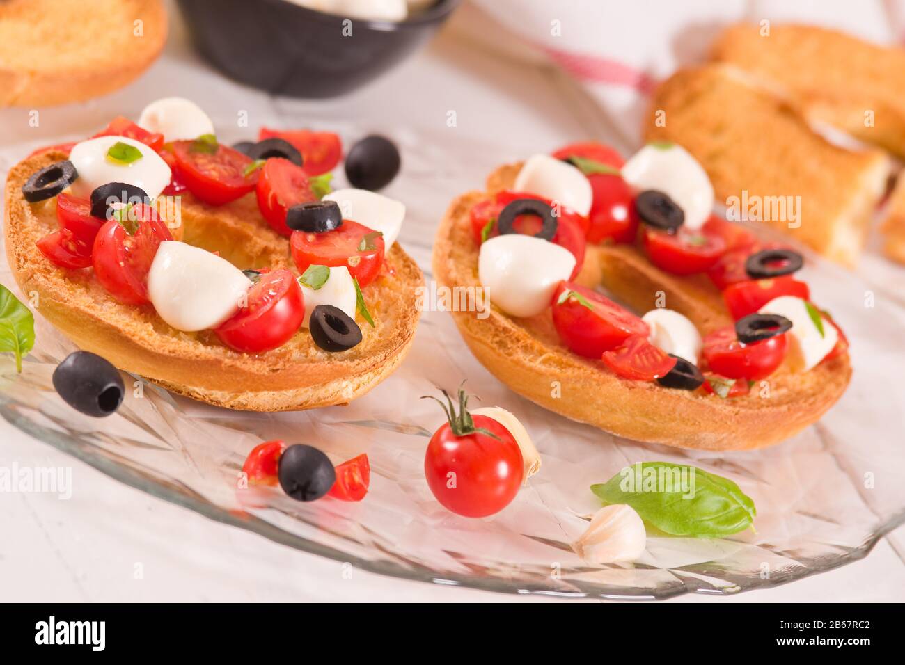 Friselle with tomatoes and mozzarella cheese Stock Photo - Alamy