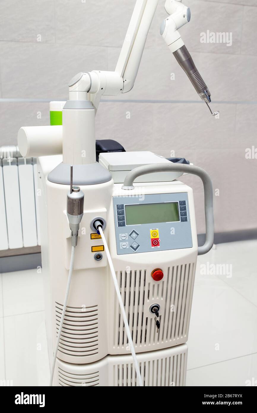 Professional universal laser medical system device in clinic interior ...