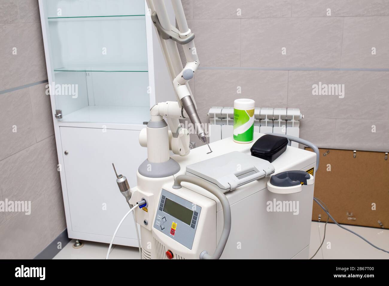 Professional universal laser medical system device in clinic interior ...