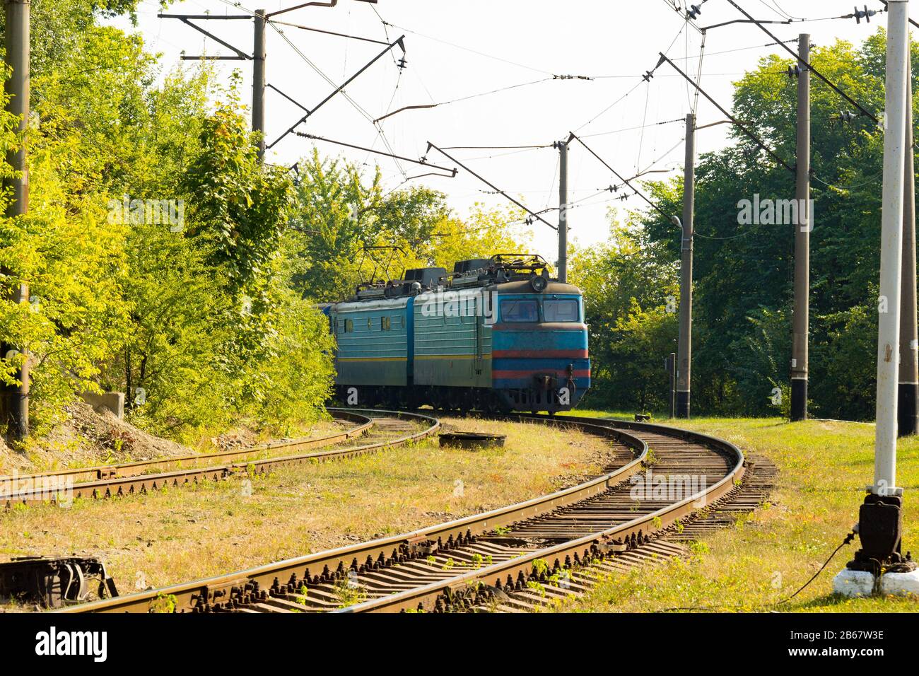 Old blue train is arriving at the platform at the railway station Stock ...