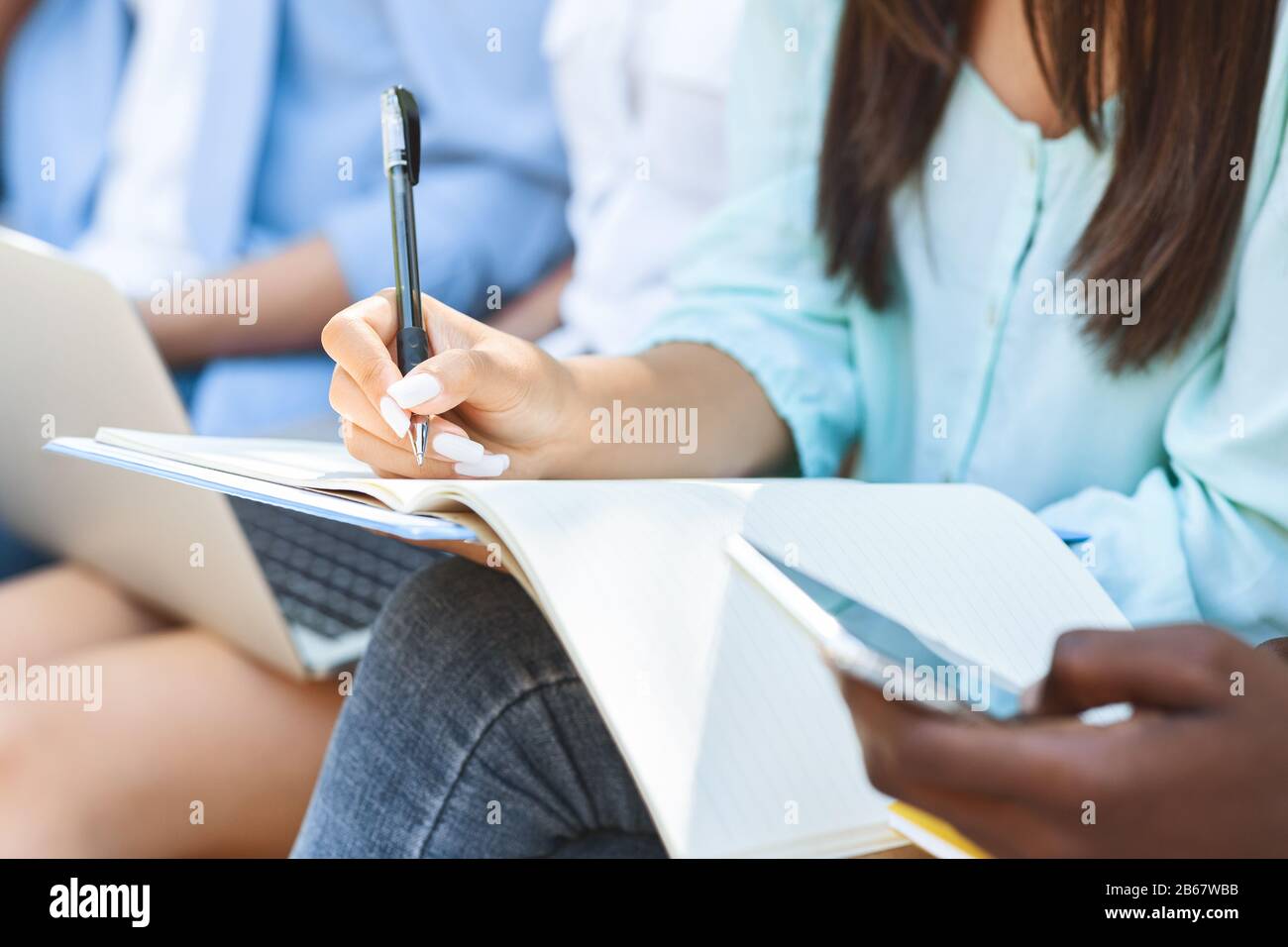 Unrecognizable Student Girl Preparring For Classes, Writing In Workbook ...