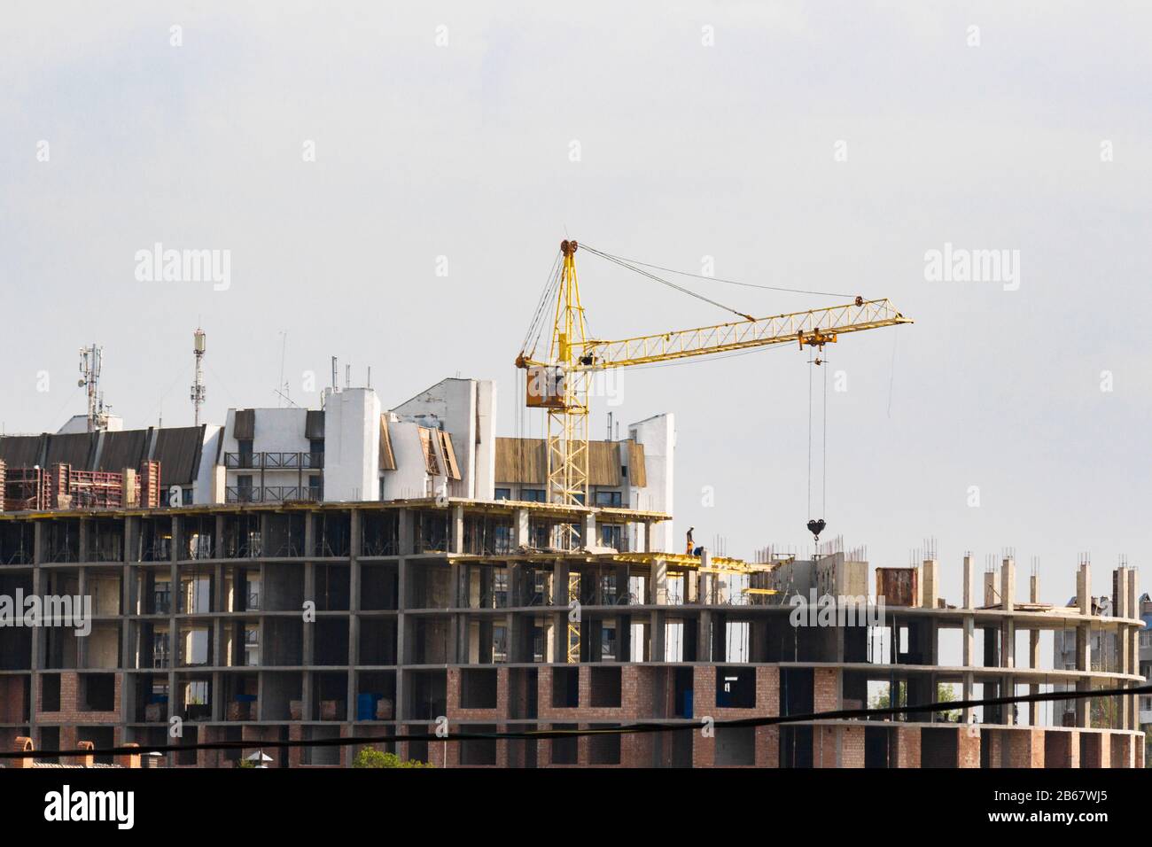 Industrial background made of crane construction at the buildings ...