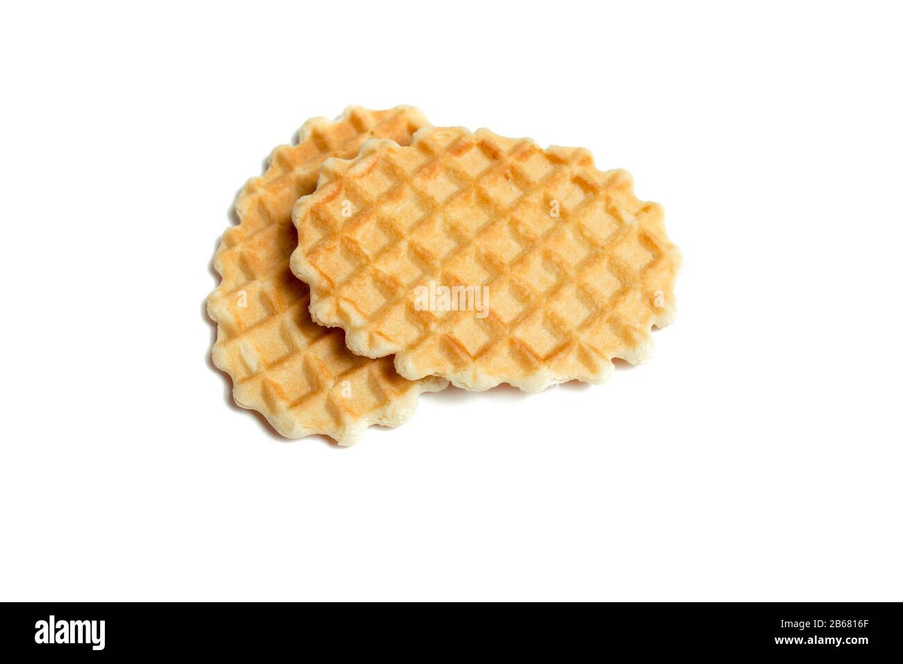 Two golden round waffles isolated over white background Stock Photo - Alamy