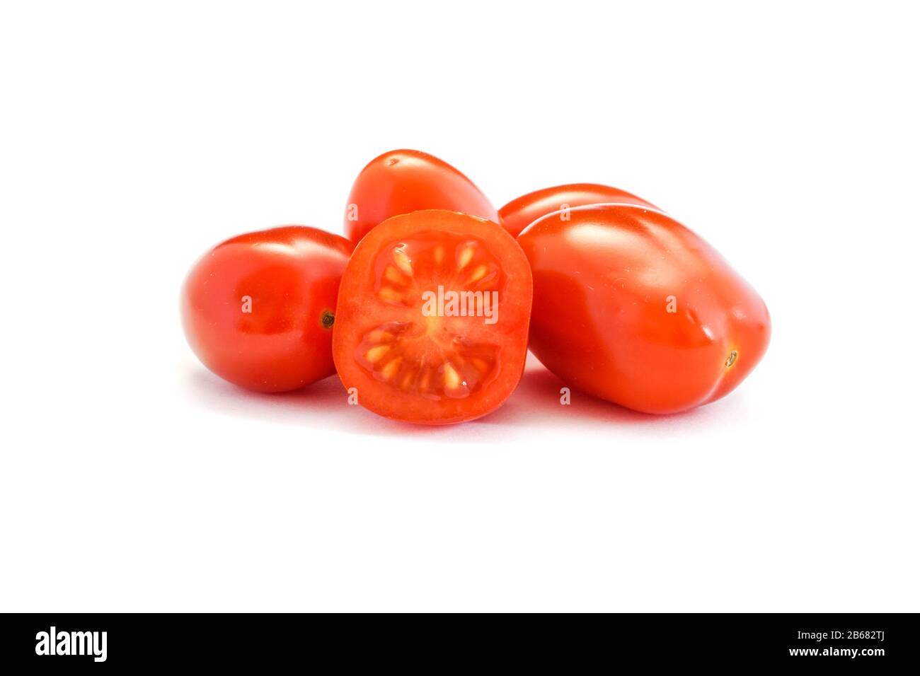 Roma tomatoes isolated on white background Stock Photo - Alamy