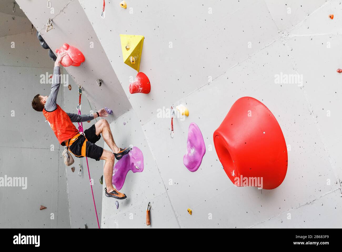Sport and fitness Man on Extreme Climbing Wall boulder gym Stock Photo ...