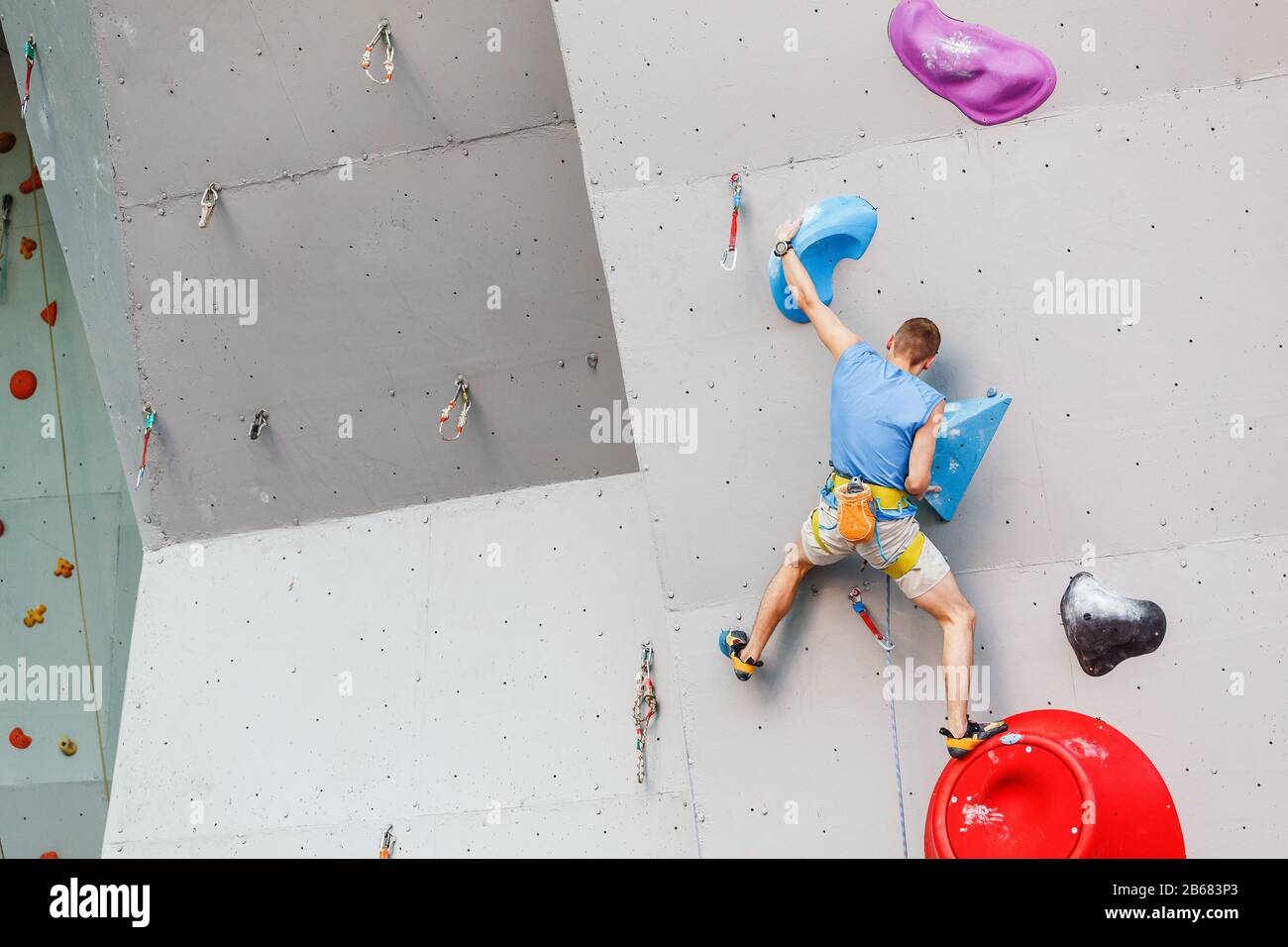Sport and fitness Man on Extreme Climbing Wall boulder gym Stock Photo ...