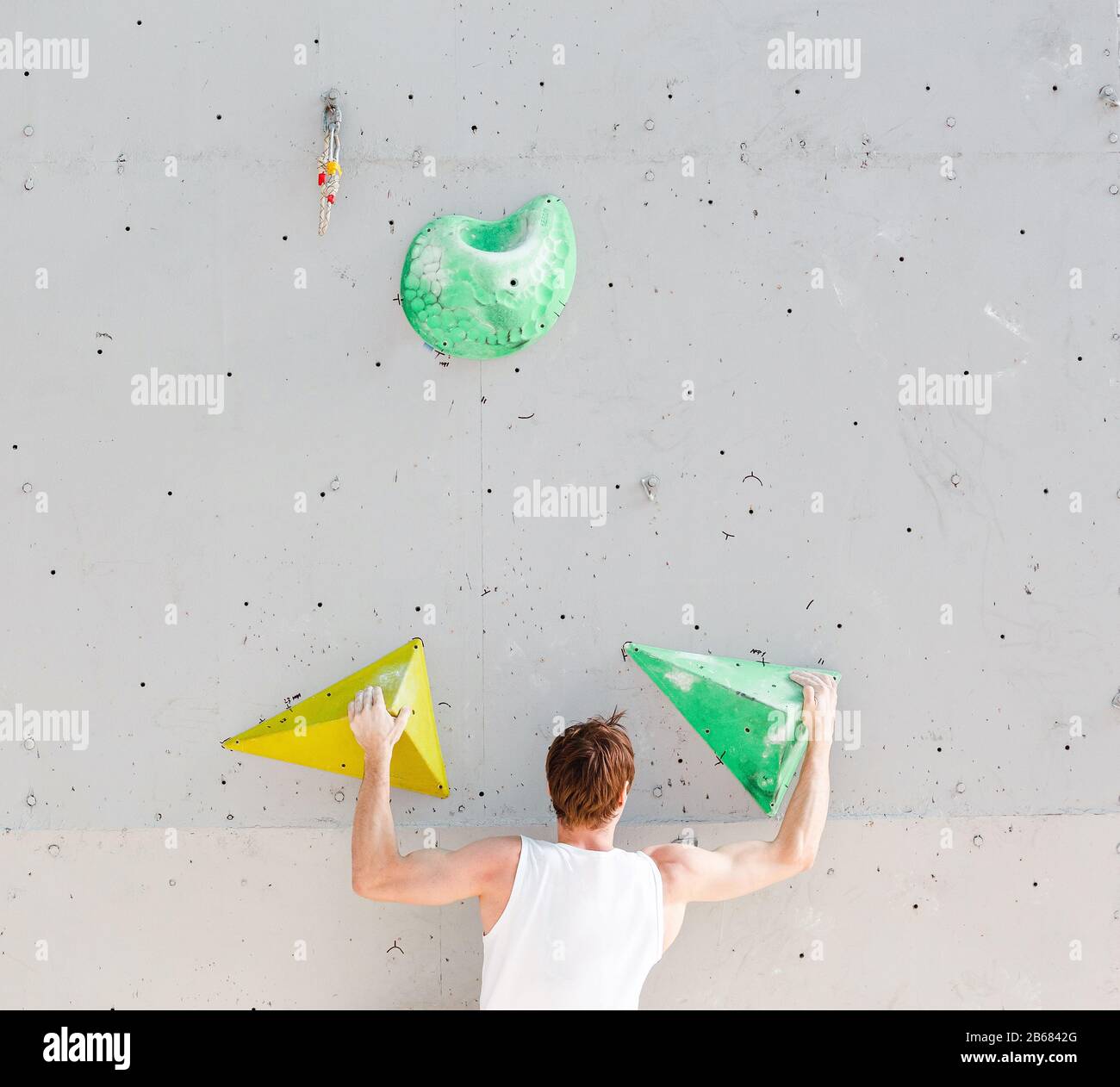 Sport and fitness Man on Extreme Climbing Wall boulder gym Stock Photo ...