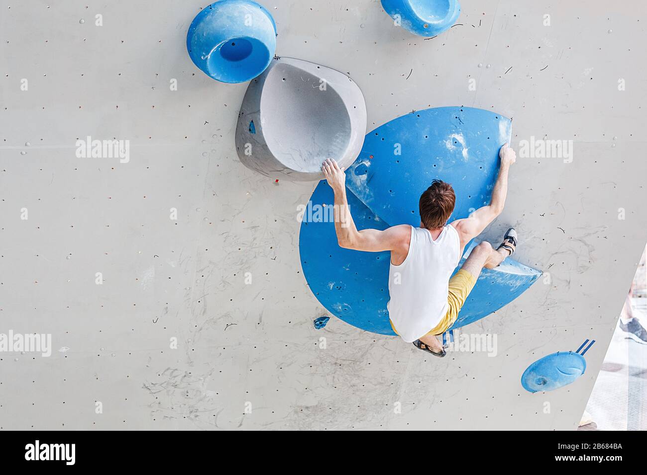 Sport and fitness Man on Extreme Climbing Wall boulder gym Stock Photo ...