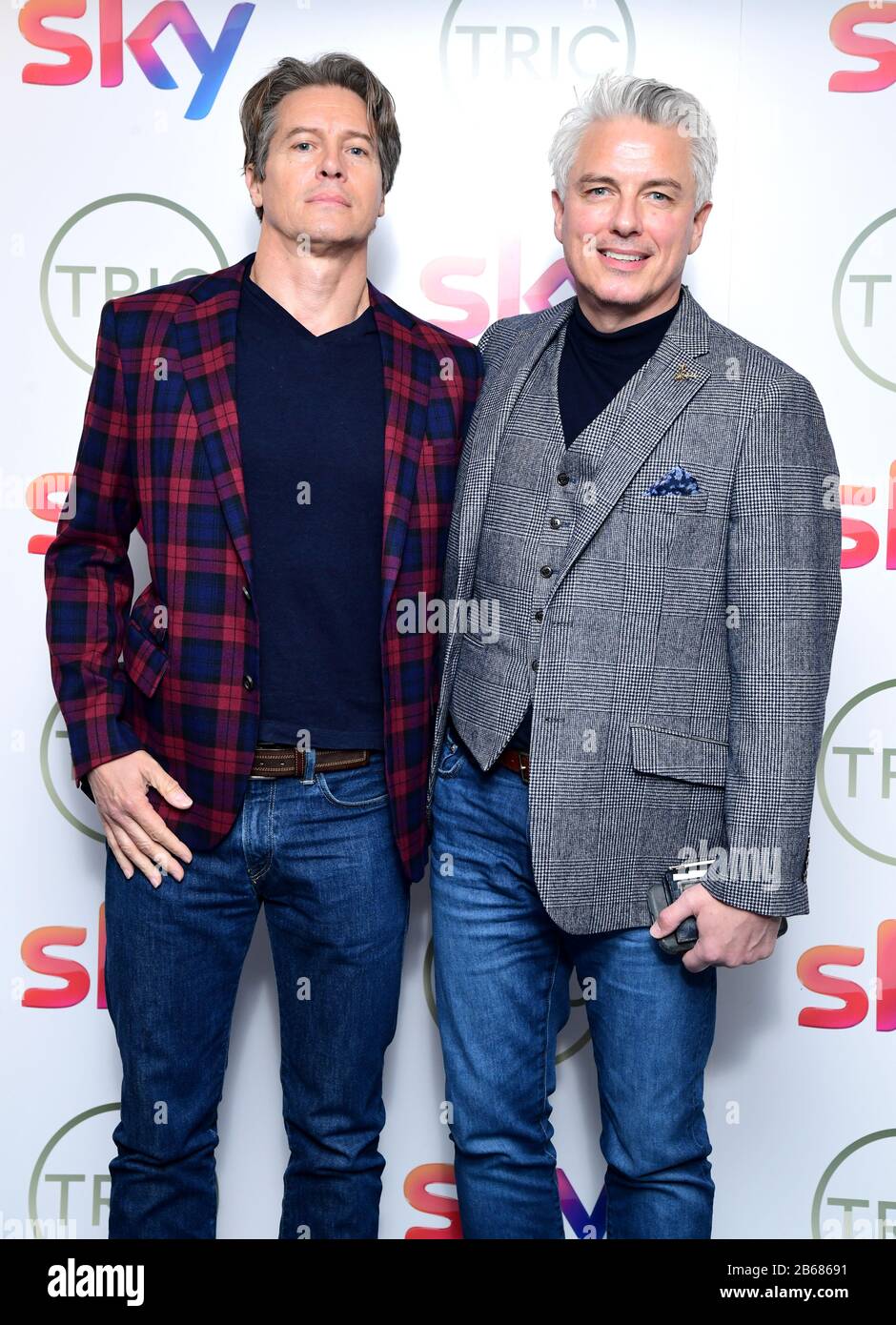 John Barrowman (right) and Scott Gill attending the TRIC Awards 2020 ...