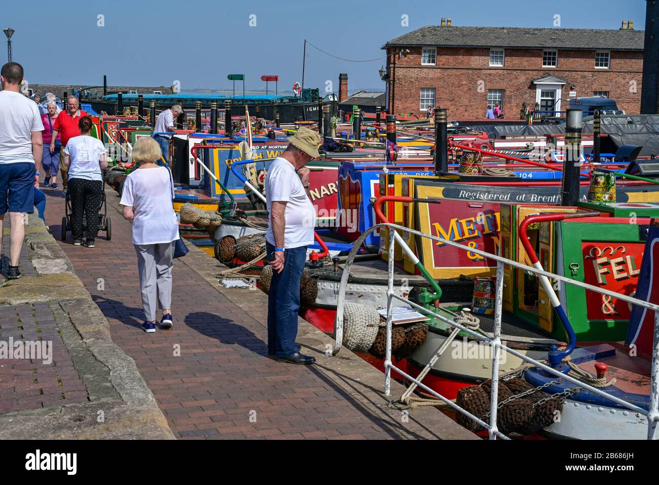 People look at canal boats from around the country at the National ...