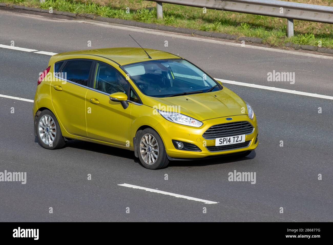 2014 yellow Ford Fiesta Titanium X; UK vehicular traffic, transport ...