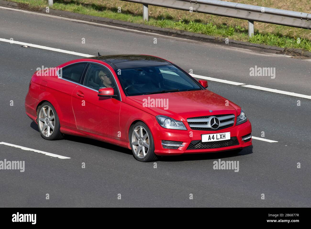 2015 red Mercedes-Benz C220 AMG Sport ED Prem ; UK vehicular traffic ...