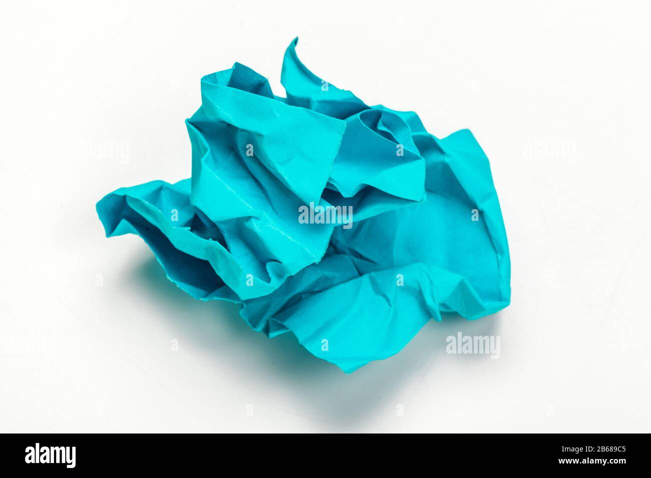 close up of a crumpled paper with curled edge on white background Stock ...