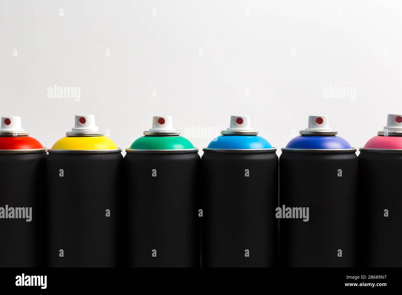 Spray paint cans close up creative photo Stock Photo - Alamy