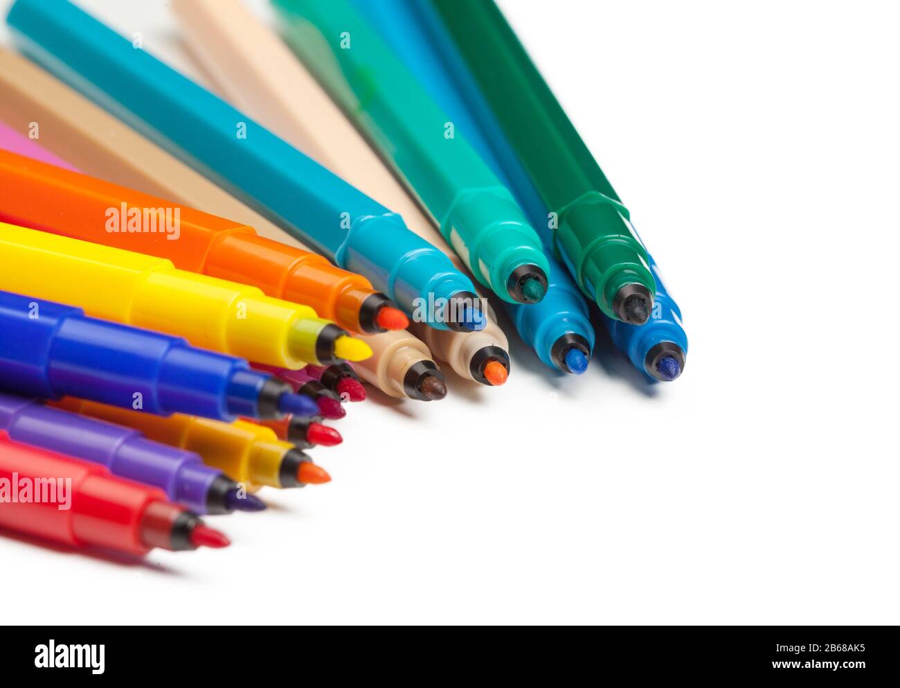 Colored markers isolated on white background close up. creative photo ...