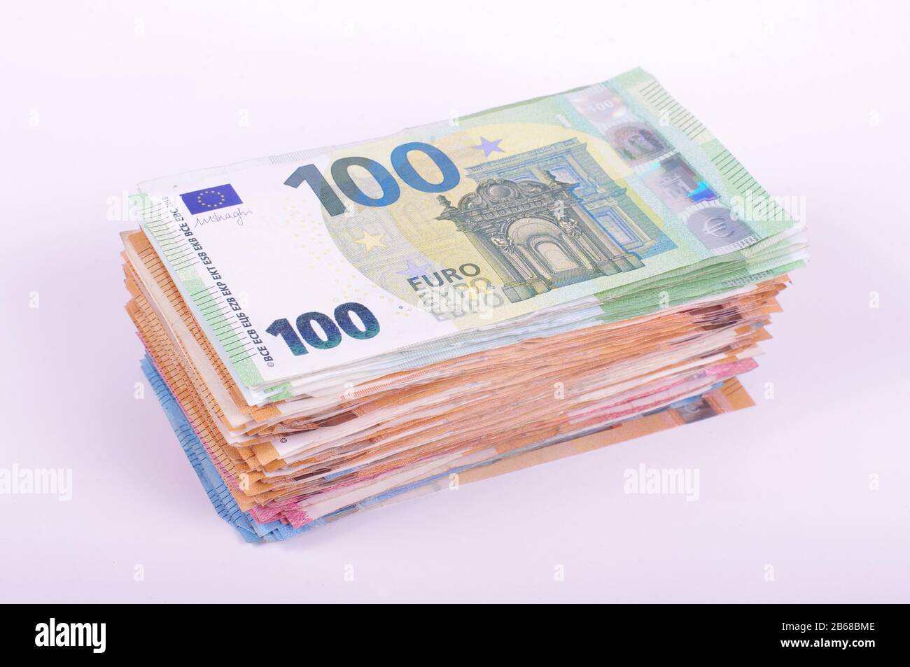 Pile of Euro banknotes isolated on the white background. Savings and ...
