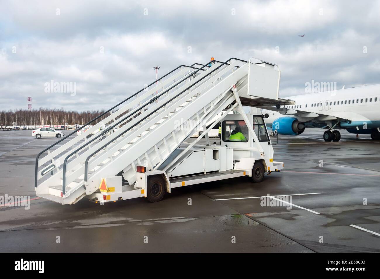 Passenger gangway next to aircraft at the airport Stock Photo - Alamy