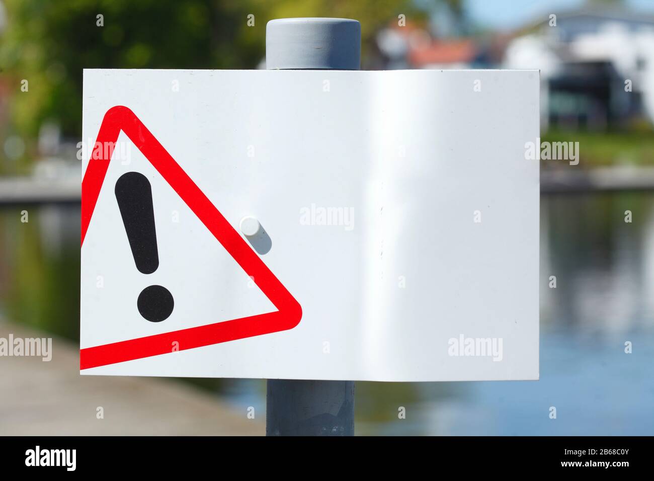 Sign danger point, warning triangle Stock Photo - Alamy