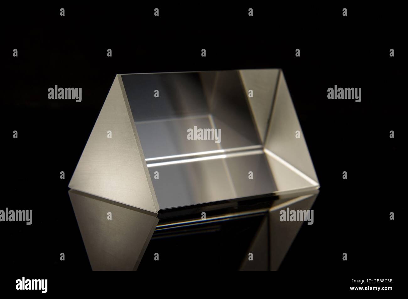 Triangular optical prism for scientific experiments isolated on the ...