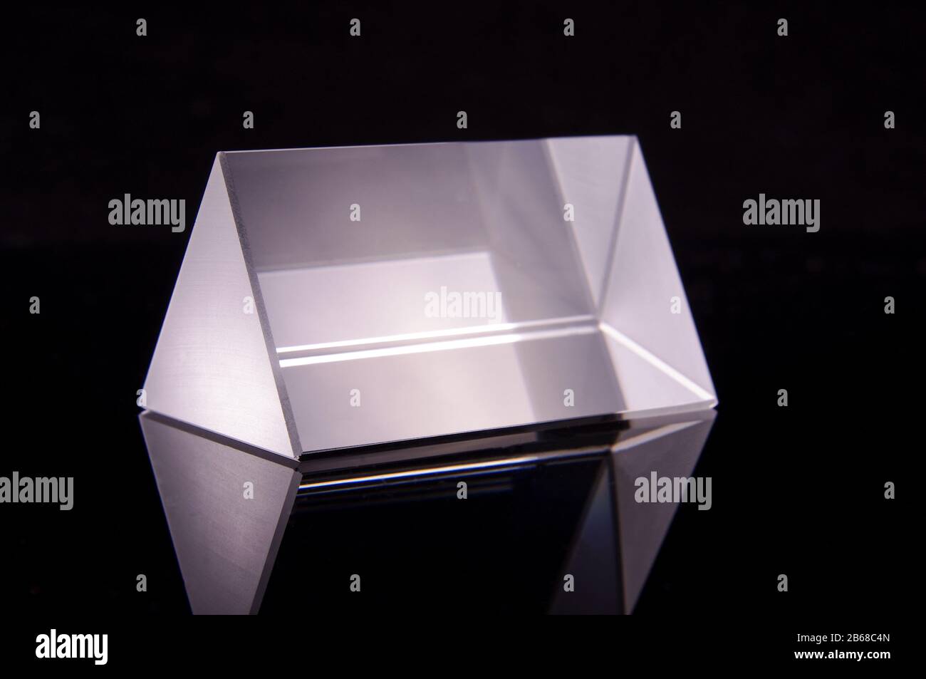 Triangular optical prism for scientific experiments isolated on the ...