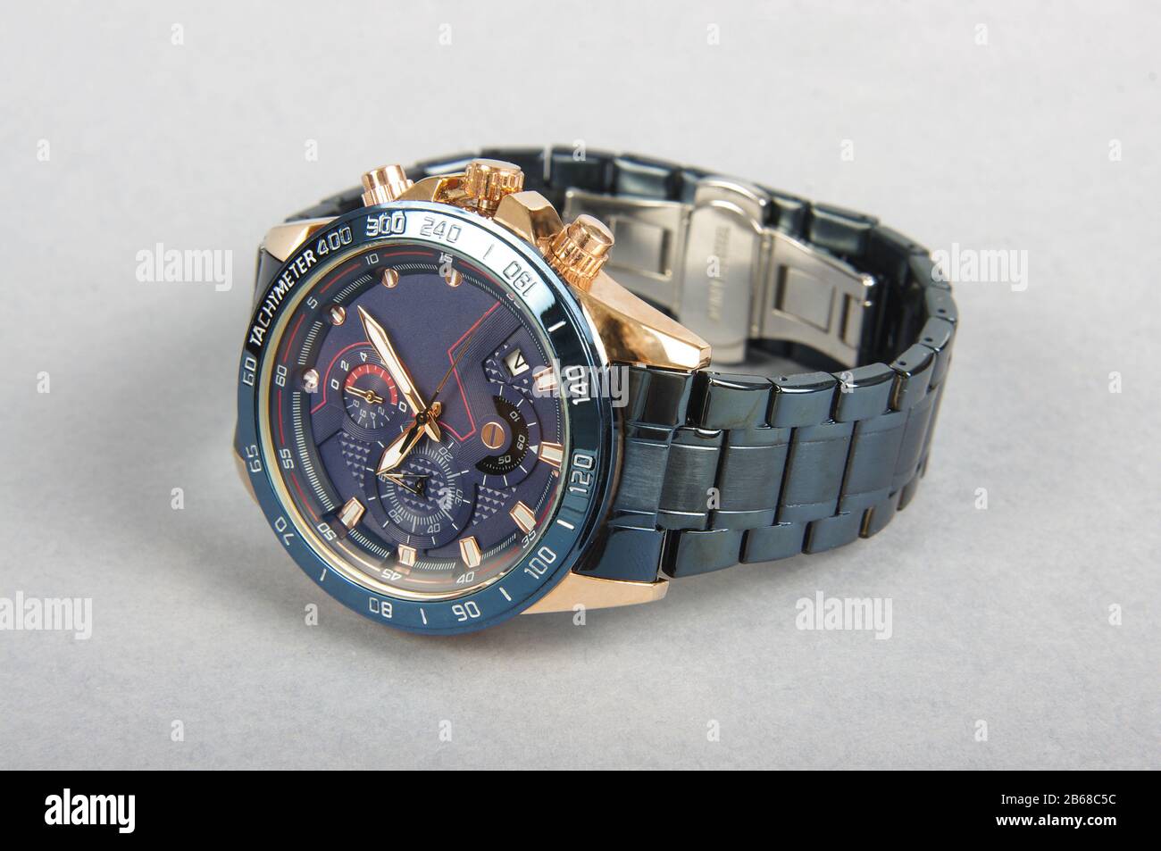 Professional luxury golden blue male watch on the gray surface Stock ...