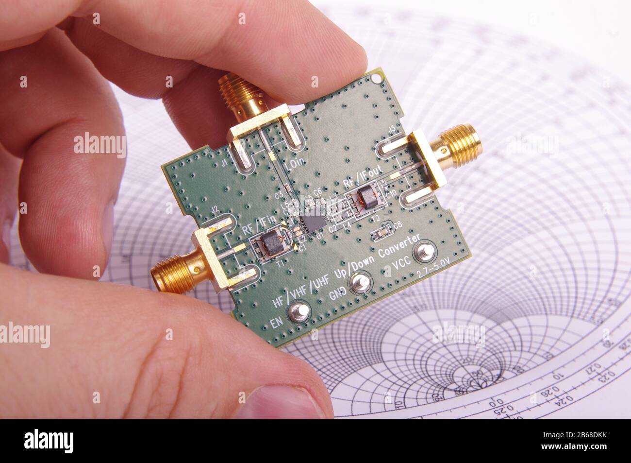 Radio frequency engineer inspect microwave mixer printed circuit board ...