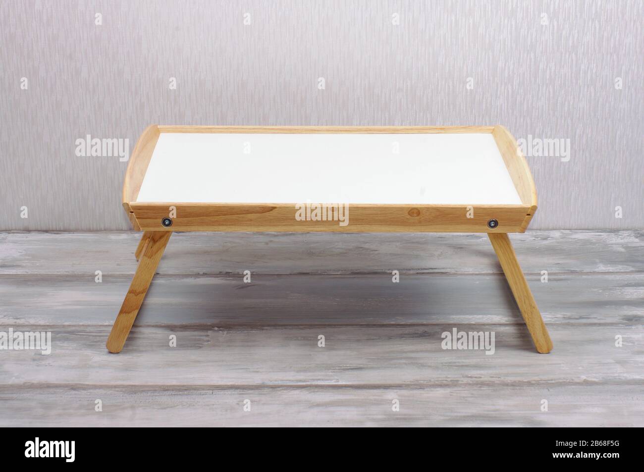 Small empty wooden bed table for having breakfast in the bed Stock ...