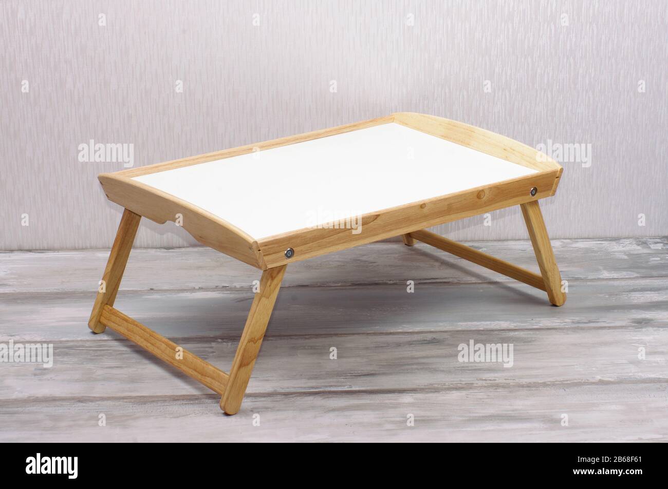Small empty wooden bed table for having breakfast in the bed Stock ...