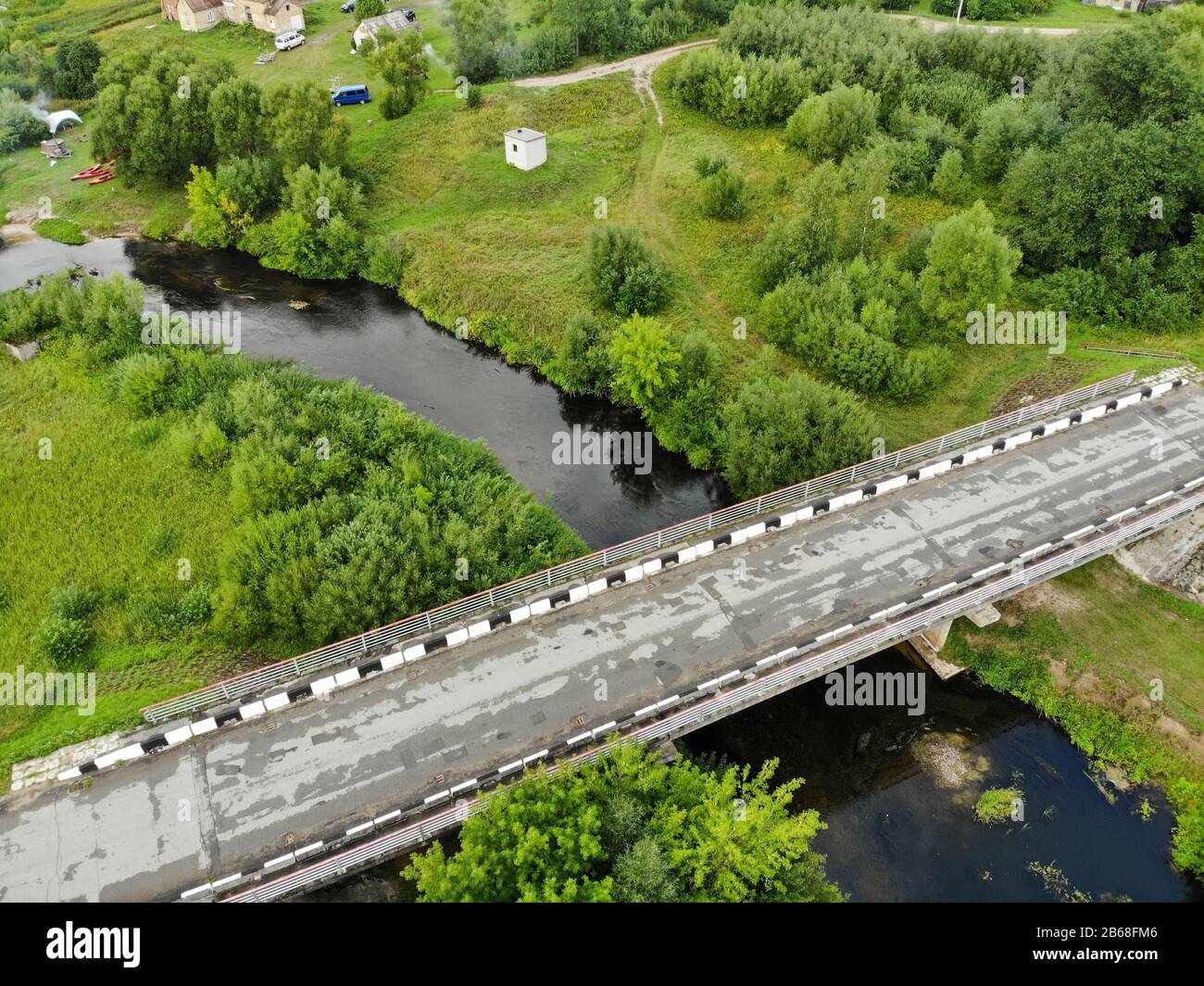 Old bridge and road over the Dusysa river in Lyduvenai town, Lithuania ...