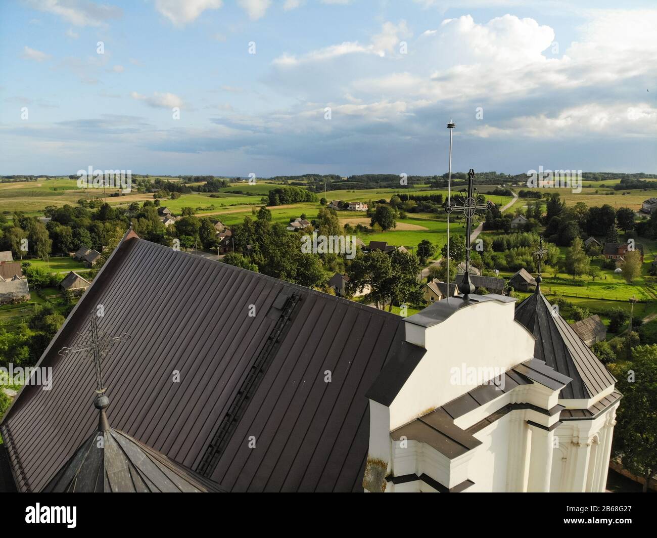 Church roof close up view with crosses and lightning rod of Kraziai ...