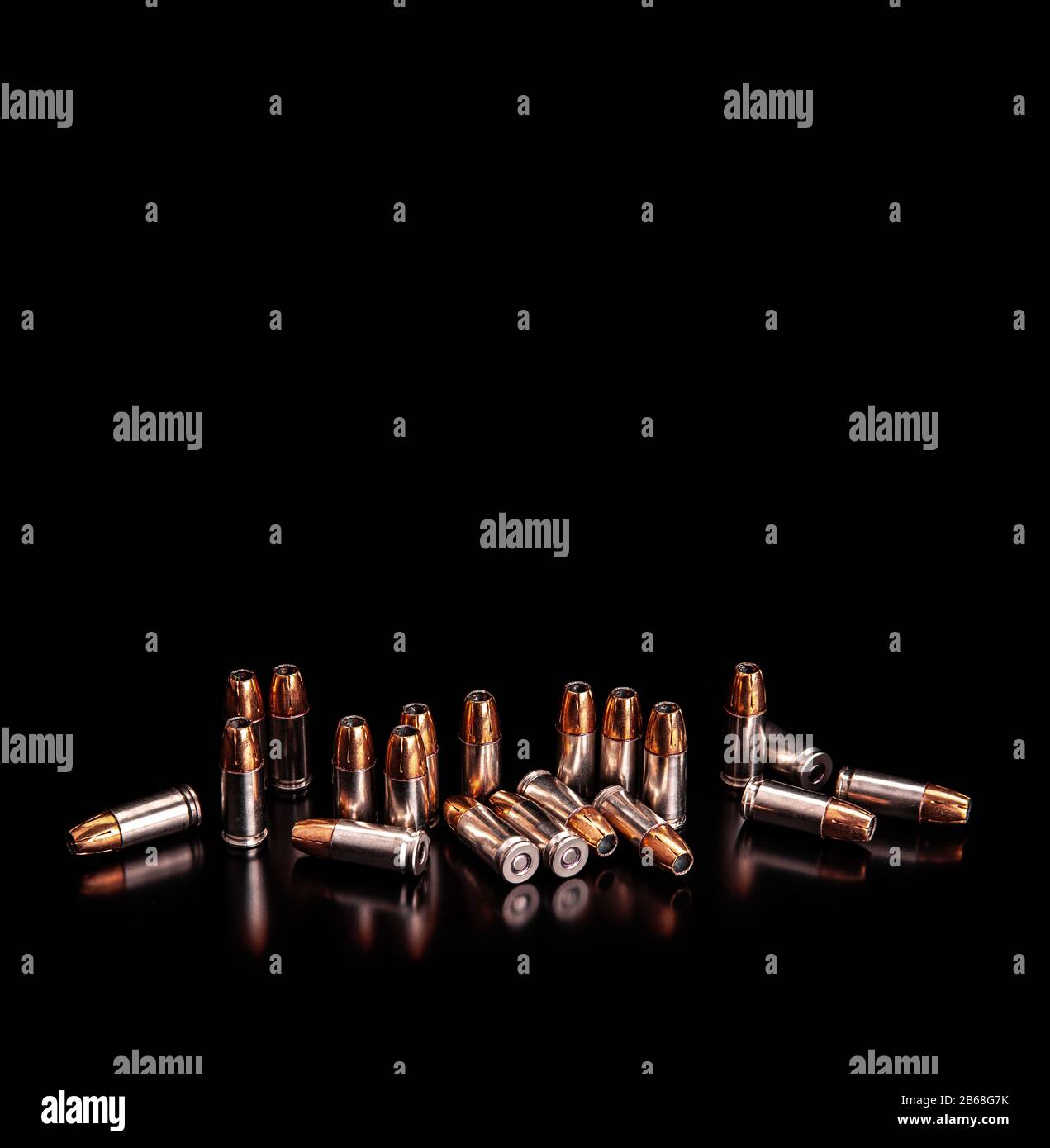 Shiny cartridges for the gun on a dark background. Ammunition for the ...