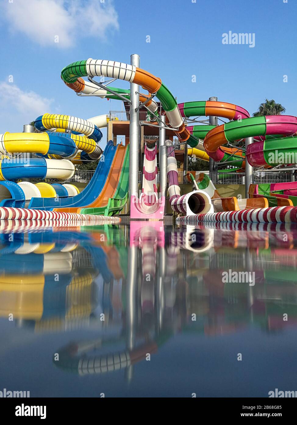 Colorful plastic water-slides in a swimming pool Stock Photo - Alamy