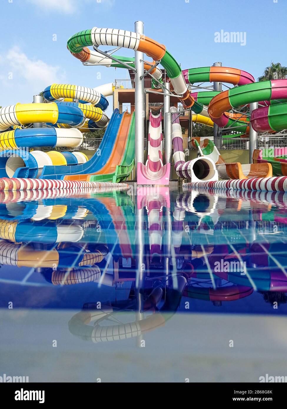 Colorful plastic water-slides in a swimming pool Stock Photo - Alamy