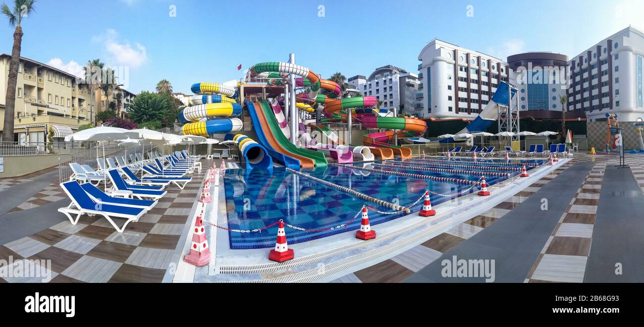 Colorful plastic water-slides in a swimming pool Stock Photo - Alamy