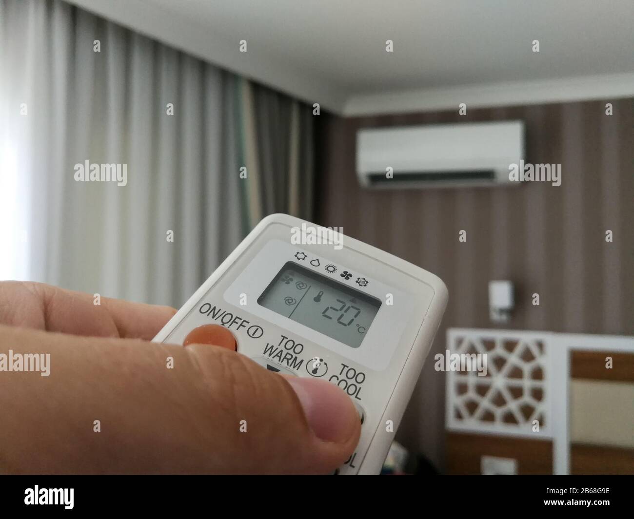 Remote control setting temperature for air conditioner on the wall ...